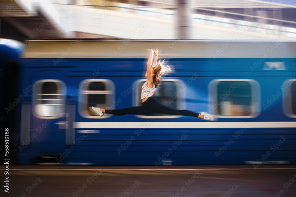 Jumping ballerina with train background Stock Photo | Adobe Stock