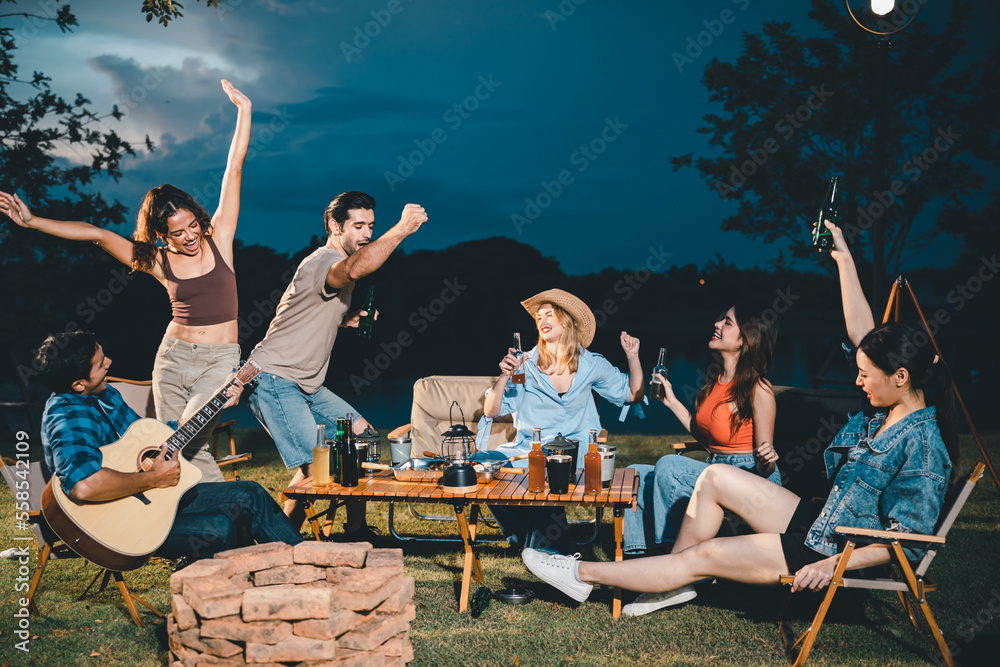 summer party camping of friends group with guitar music, happy young ...