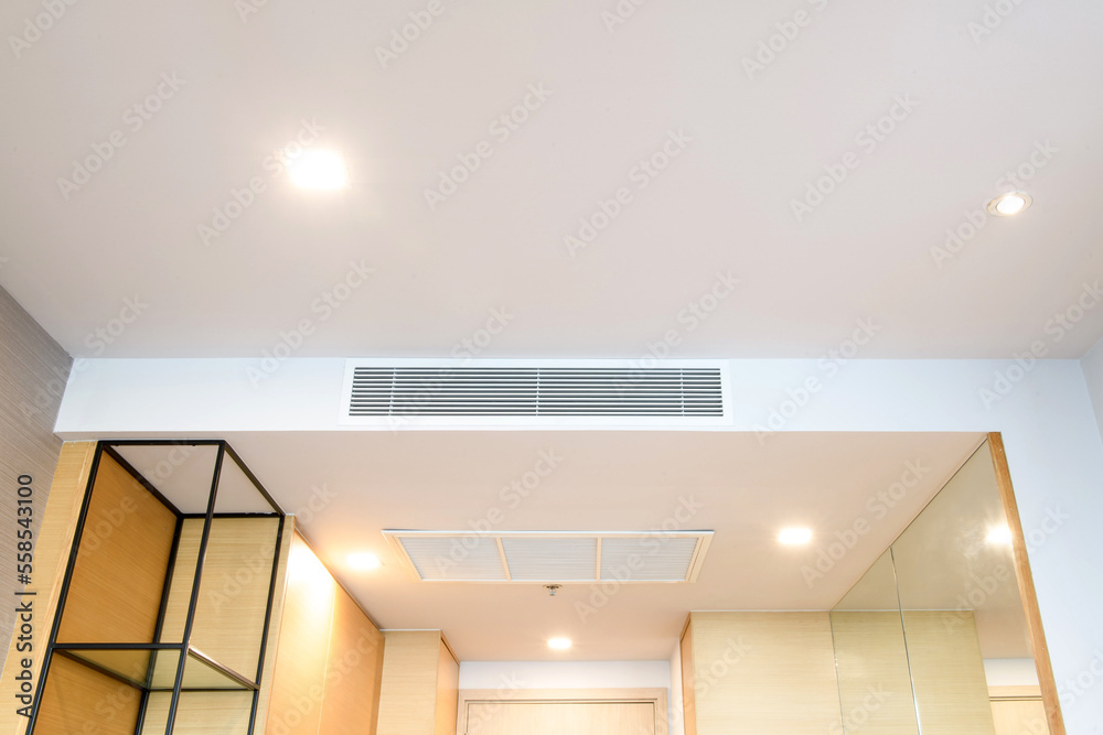 Ceiling mounted cassette type air conditioner and modern lamp light on ...