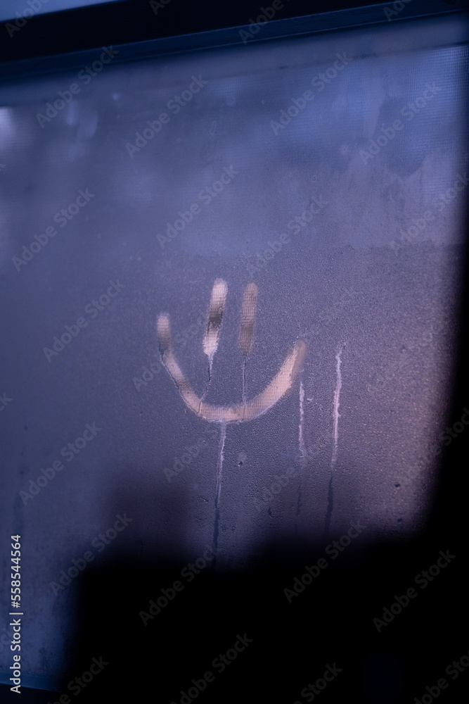 smiley face drawn on window Stock Photo | Adobe Stock