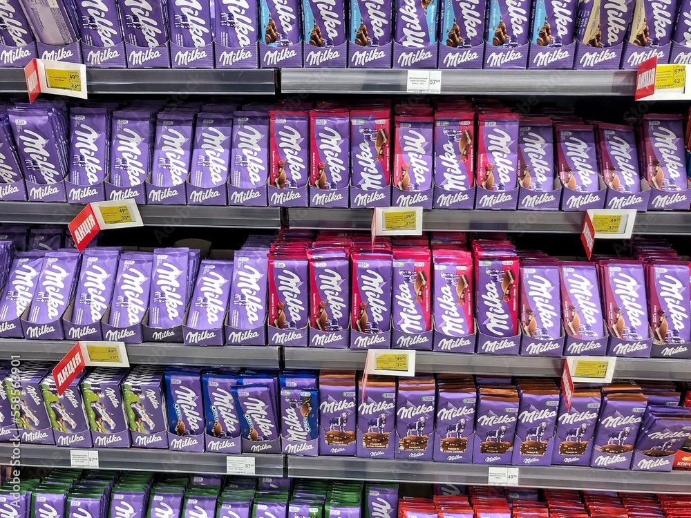 26.12.2022, Ukraine, Kharkiv, Milka chocolate on store shelves. Many ...