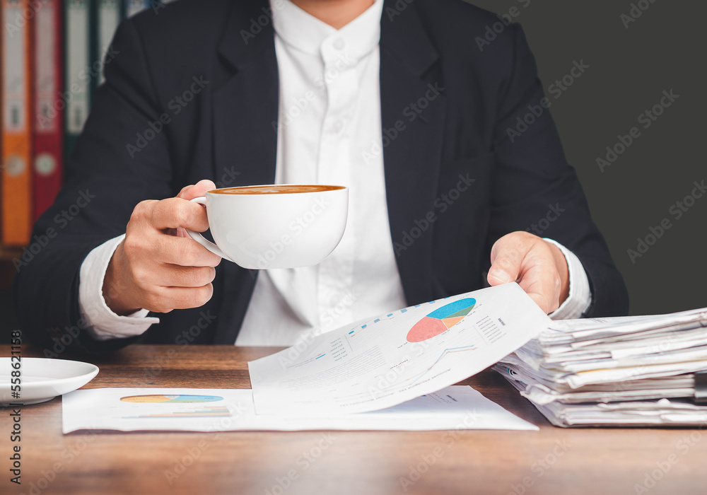 Hand holding of form 1040 U.S. individual income tax return while ...