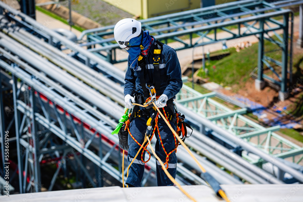 Top view male worker inspection wearing safety first harness rope ...