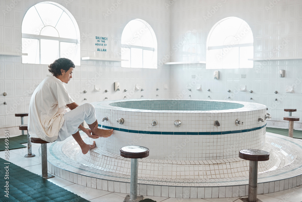 Islam, ablution and man washing before prayer in bathroom at mosque in ...