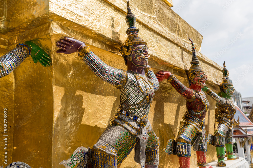 The Statues of demon guardians at the Grand Palace in Bangkok, Thailand ...