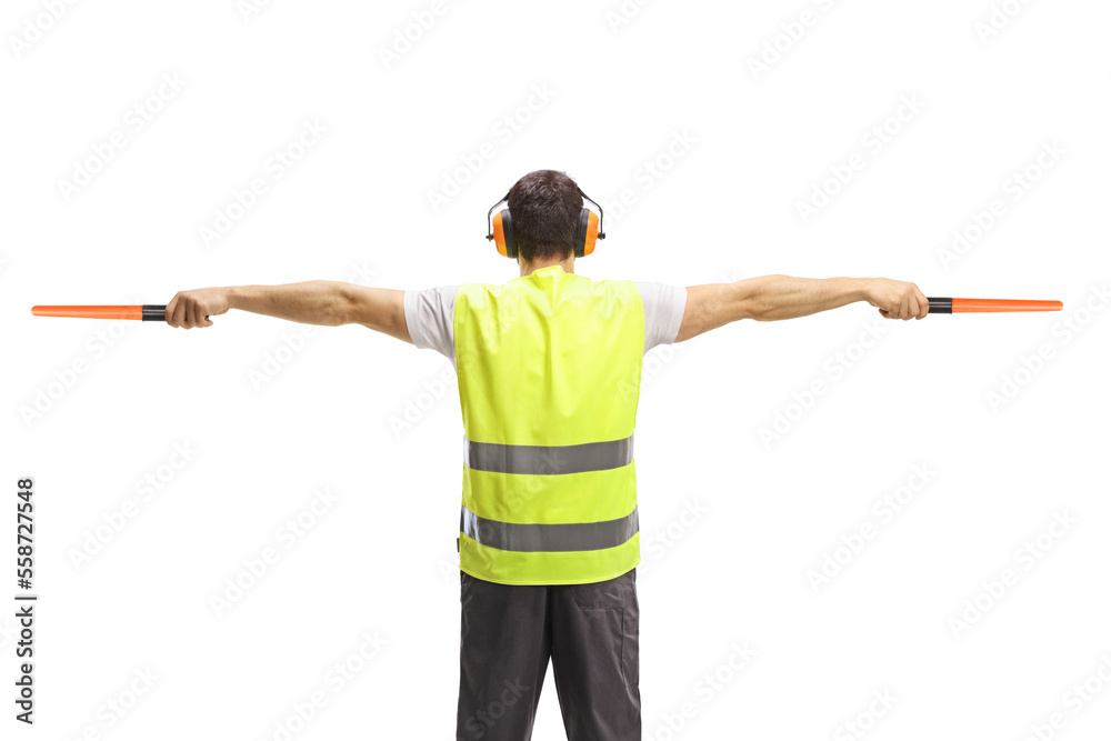 Back view of an aircraft marshaller signalling with wands Stock Photo ...