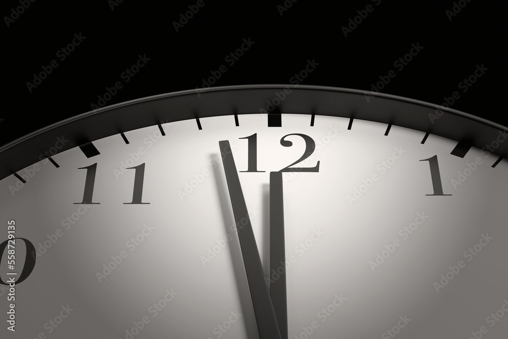 Round black and white clock with both the hour arm and minute arm ...