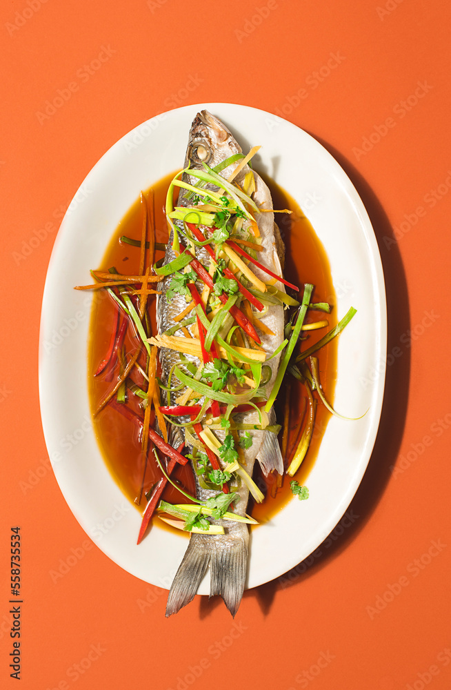 Cantonese-Style Recipes for Chinese New Year festive table. Sea bass or ...