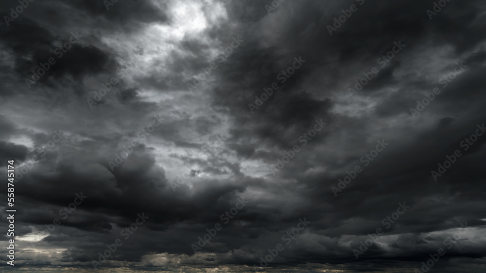 dark dramatic sky with black stormy clouds before rain or snow as ...