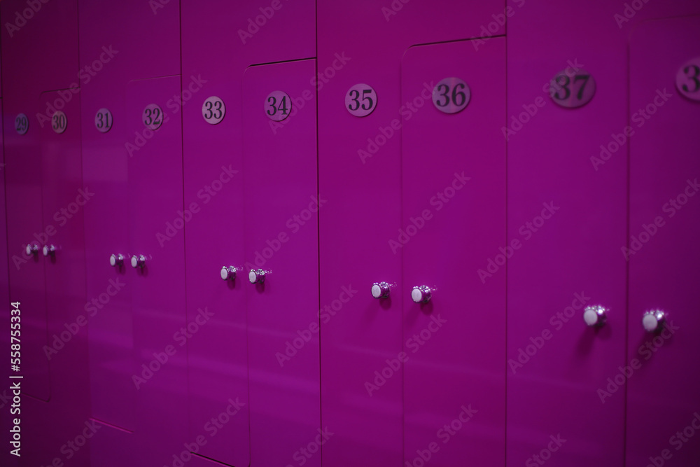 Purple locker doors with numbers. Public dressing room, locker room ...