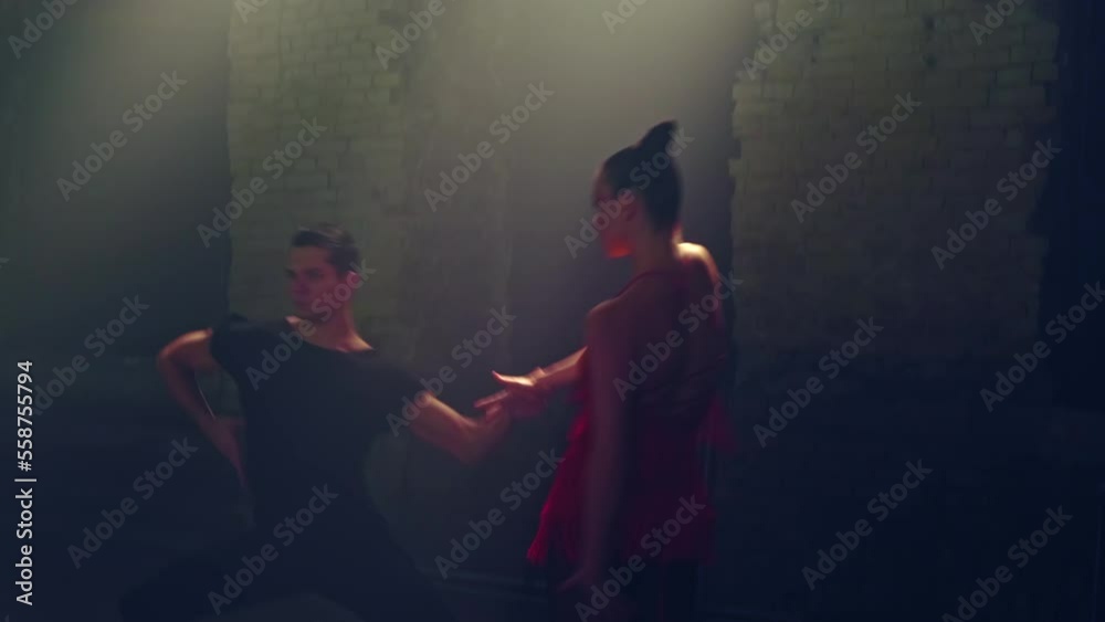 Close-up ballroom dancers dancing passionate tango eye to eye ...