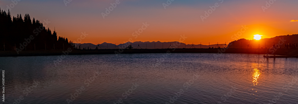 Beautiful alpine sunset view with reflections in a lake at the famous ...