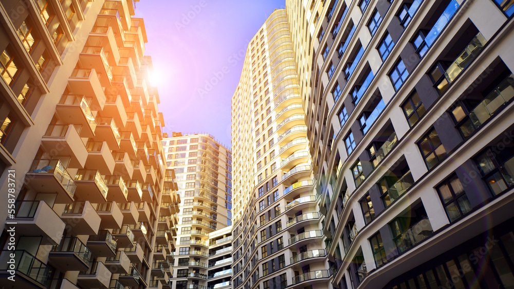 The narrow passage between modern residential buildings. Walls of high ...