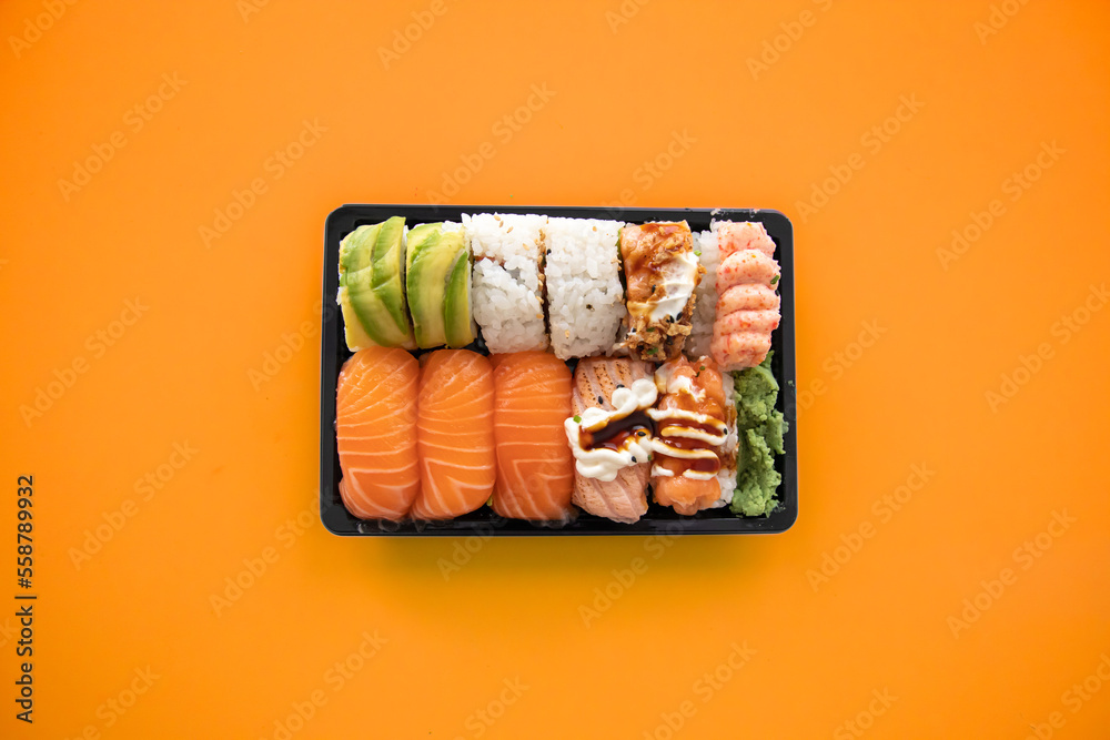 Top view of take away sushi package isolated on coloful background ...