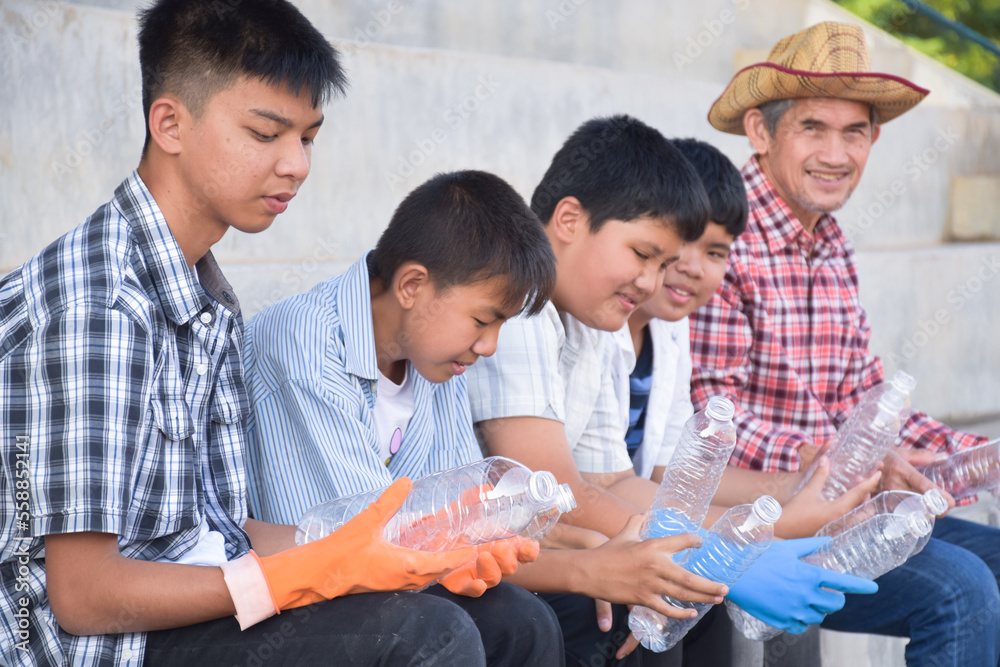 Group of young teens and senior volunteers are planing to do community ...