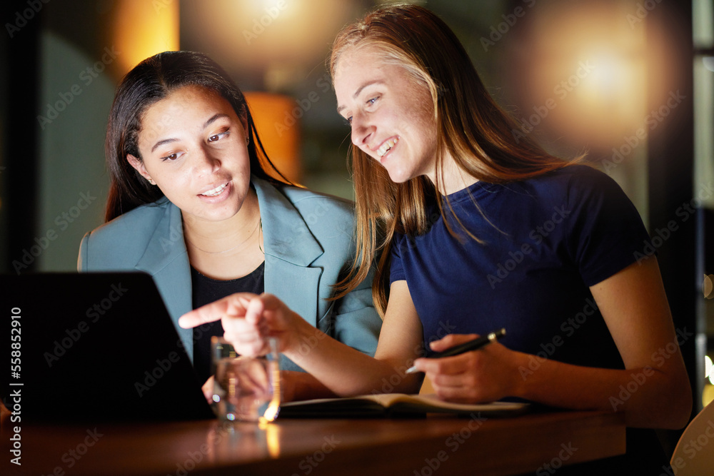 Business, women and talking at night, laptop and explain process ...