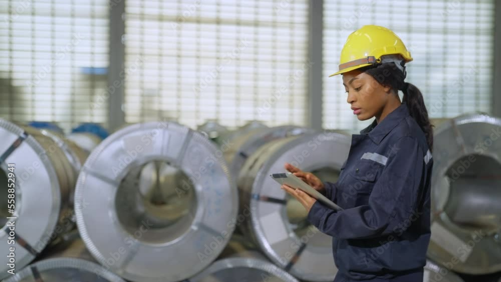 Engineer woman examining and measuring steel at lathe factory, worker ...