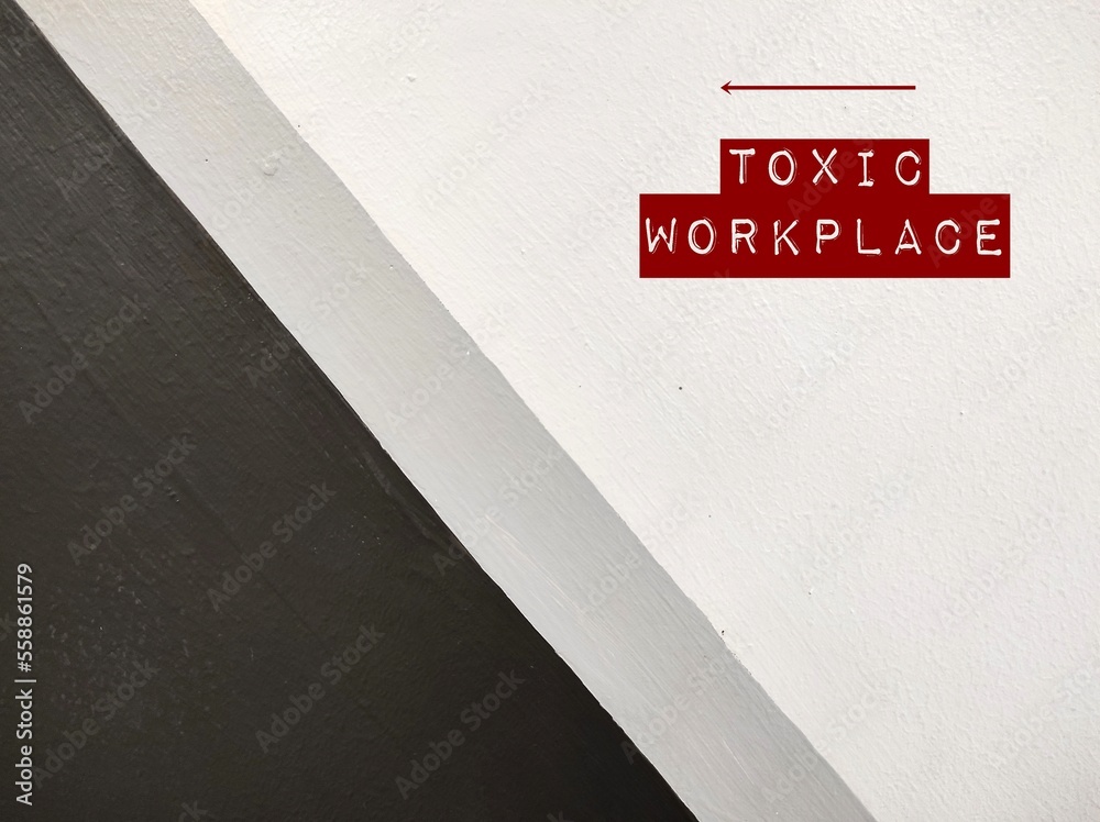 Office wall with text sign TOXIC WORKPLACE, means work environment with ...