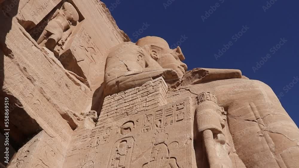 Four colossal statues of Ramesses II guard the entrance to his famous ...