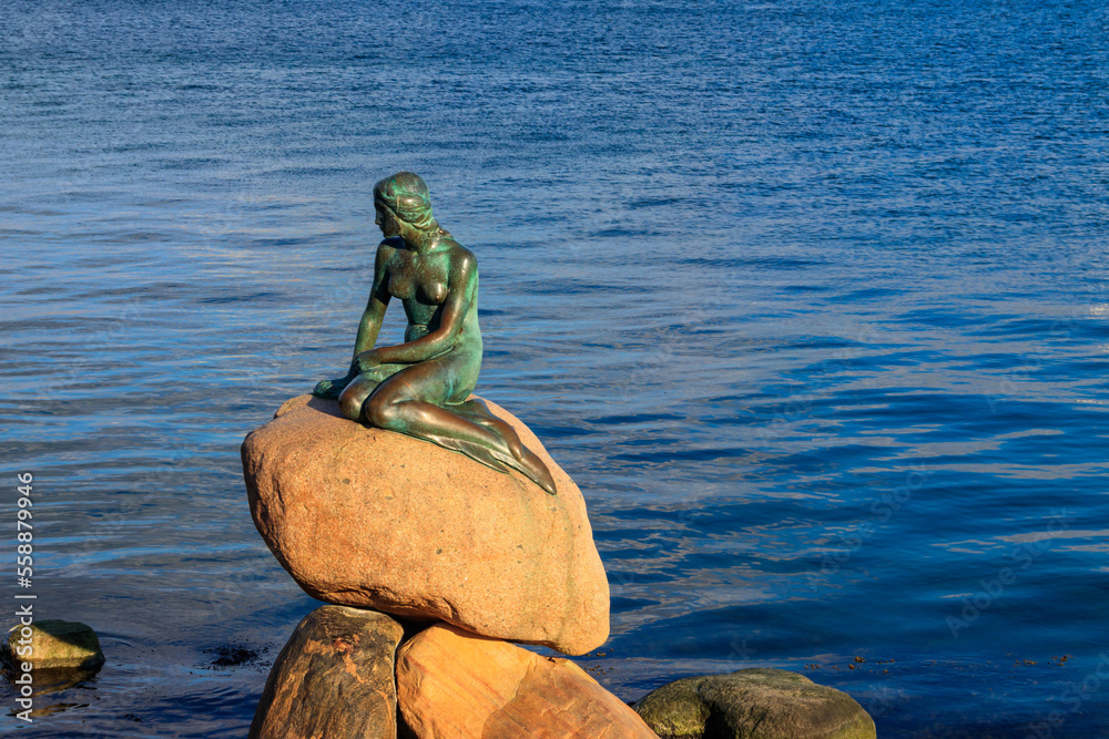 The Little Mermaid statue on a rock by the waterside at the Langelinie ...
