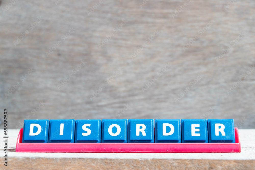Tile alphabet letter with word disorder in red color rack on wood ...