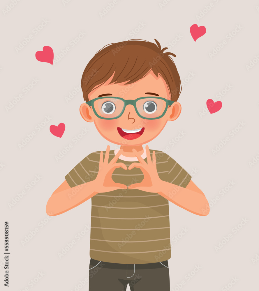 cute little boy showing heart shape sign with hands gesture symbol of ...