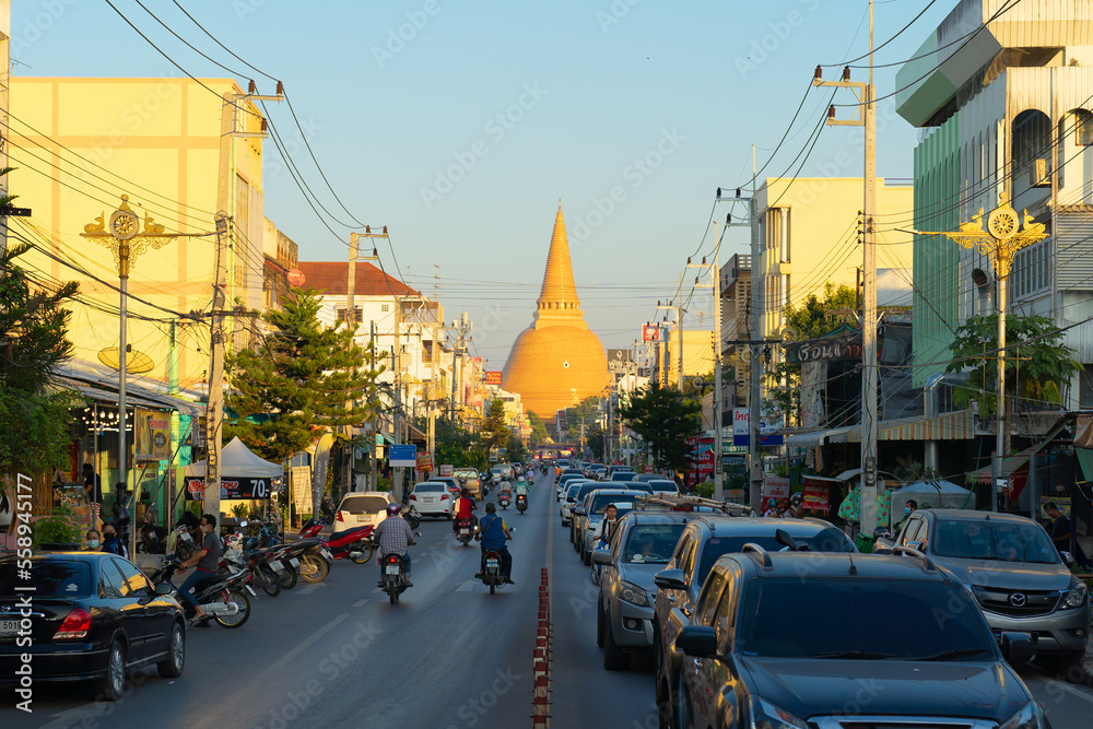 Phra Pathommachedi temple. The golden buddhist pagoda with residential ...