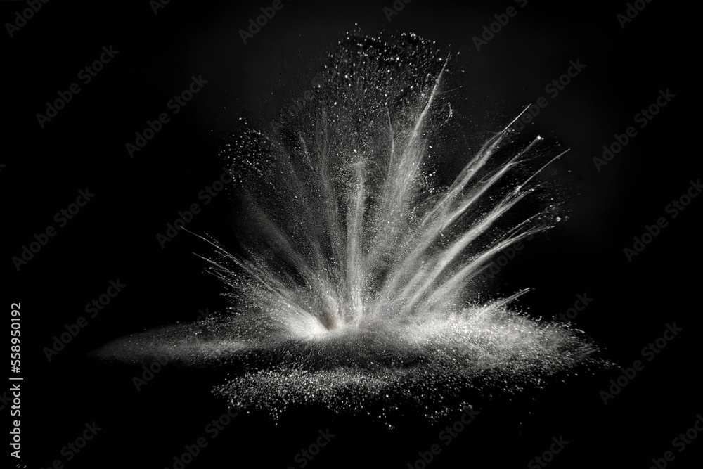 Explosion of white dust powder and particles on black background asset ...