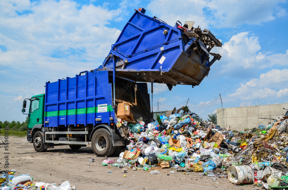 Garbage truck dumping the garbage on a landfill Stock Photo | Adobe Stock