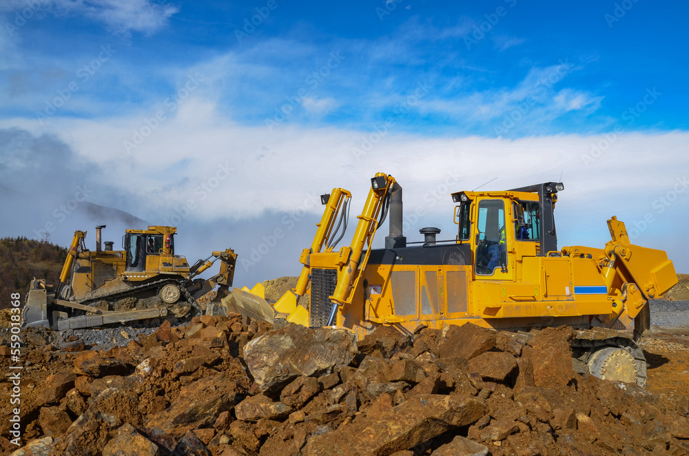 Big crawler dozer working on construction site or quarry. Mining ...