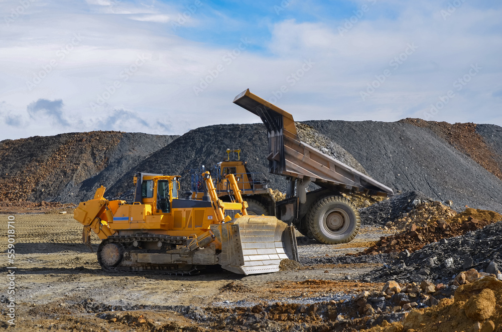 Big crawler dozer working on construction site or quarry. Mining ...