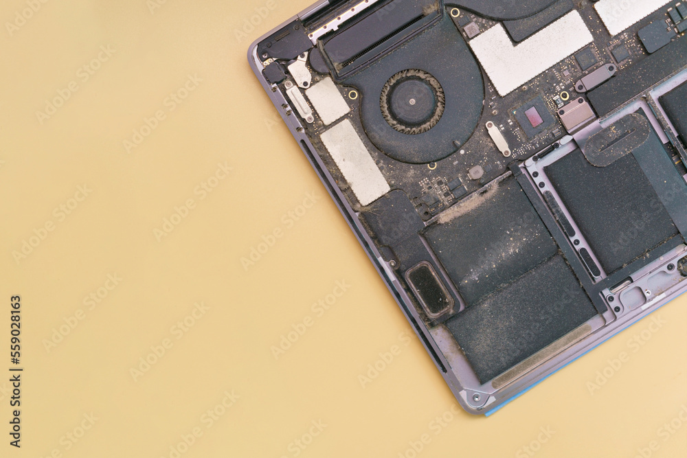 Top view on an open dirty and dusty laptop with copy space for text on ...