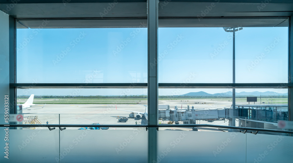 Ground glass window of airport terminal Stock Photo | Adobe Stock
