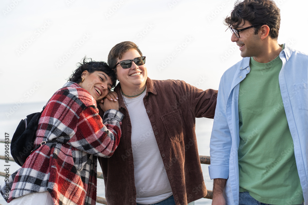 Group of four friends having fun together. Two women and one men ...