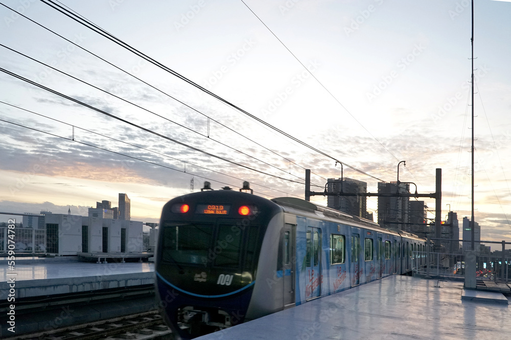 Mass Rapid Transit (MRT) train in passing Fatmawati Station with ...