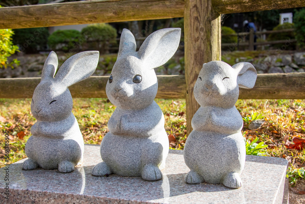 the three cute white rabbit statue in shrine Izumo-taisha in Izumo ...
