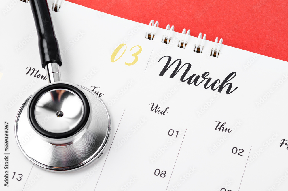 The Stethoscope medical and March 2023 desk calendar on the red ...