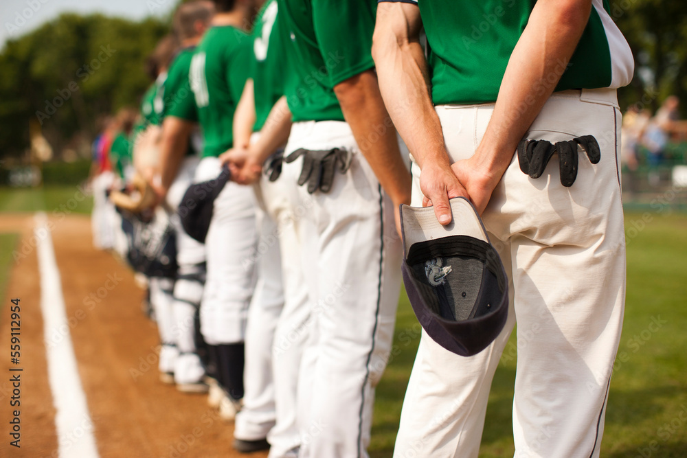 Baseball players line up before the game for introductions and the ...