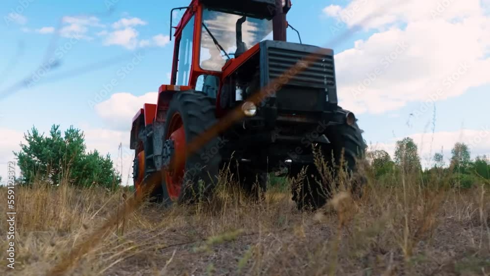 Sowing tractor. Modern tractor outside the city. Tracks on tractors ...