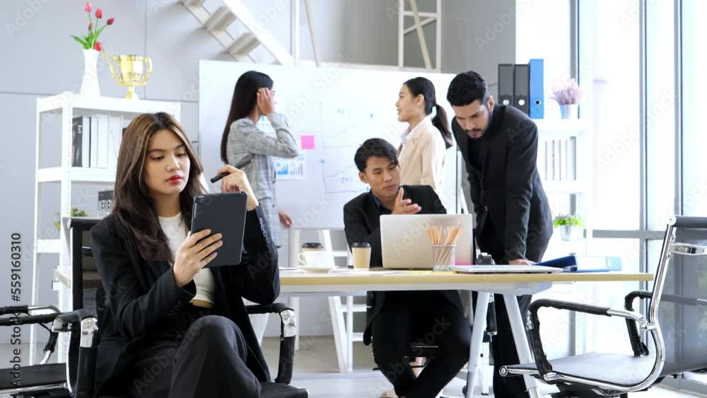 Asian portrait woman coworkers with digital tablet andstylus pen look ...