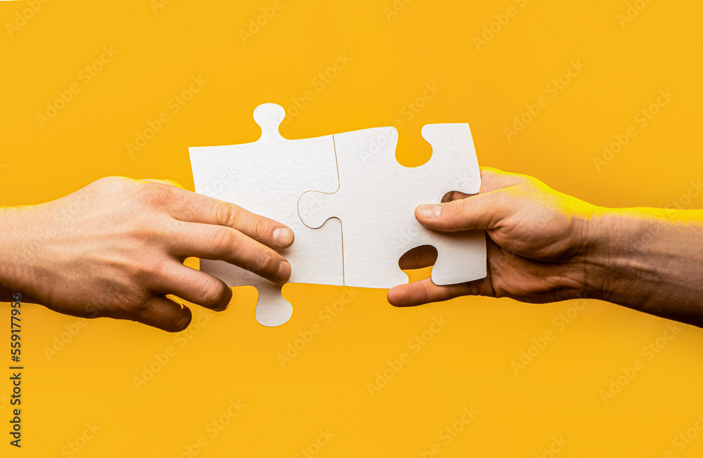 Hand connecting jigsaw puzzle. Business solutions, success and strategy ...