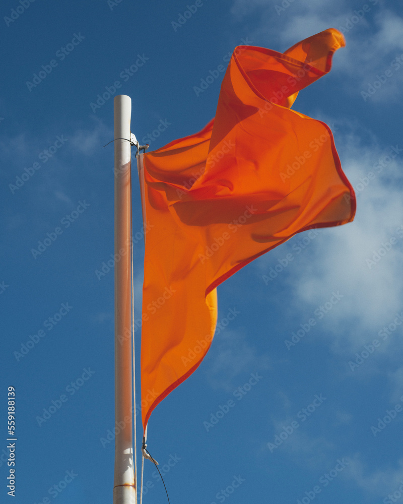 Orange flag with sky background Stock Photo | Adobe Stock