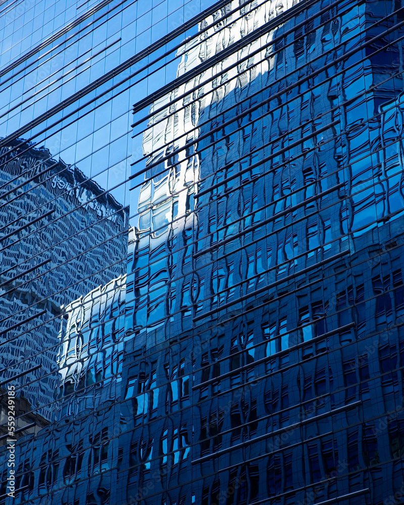 Reflection of office buildings in office building windows, Manahttan ...