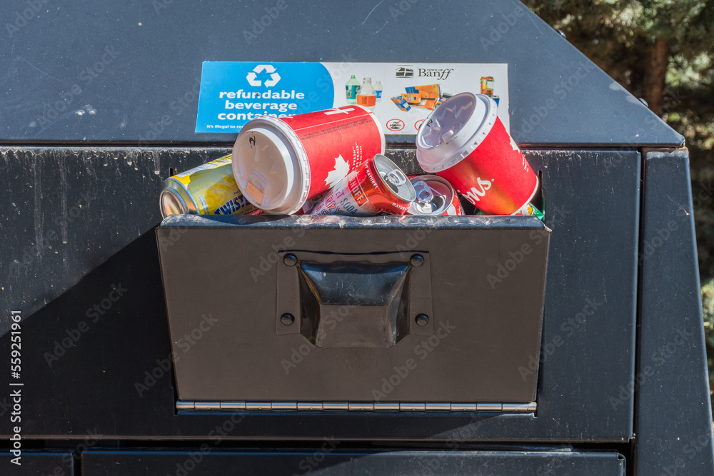 Recycling overflowing collection bin filled with used pop cans ...