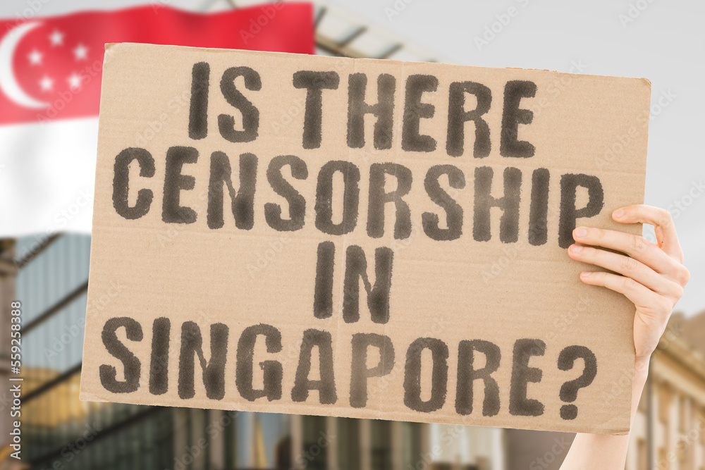 The question " Is there censorship in Singapore?" is on a banner in men ...