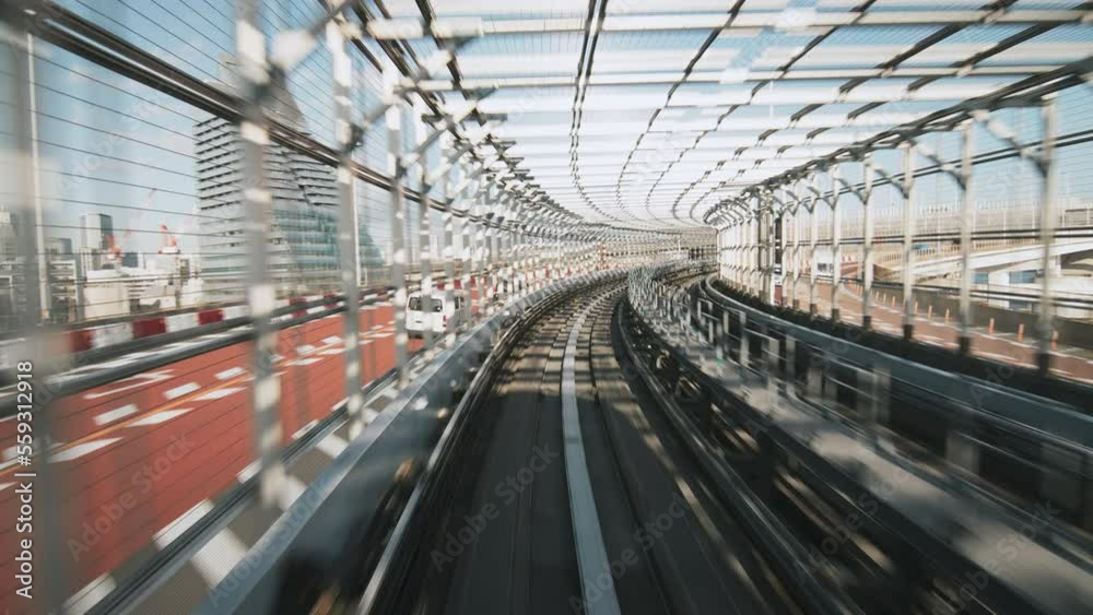 Point of view Yurikamome line automated train moving forward crossing ...