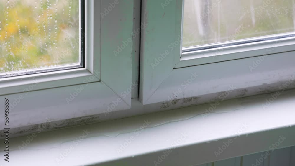 Vidéo Stock Close up of leaking moisture from gap in windows. Broken ...