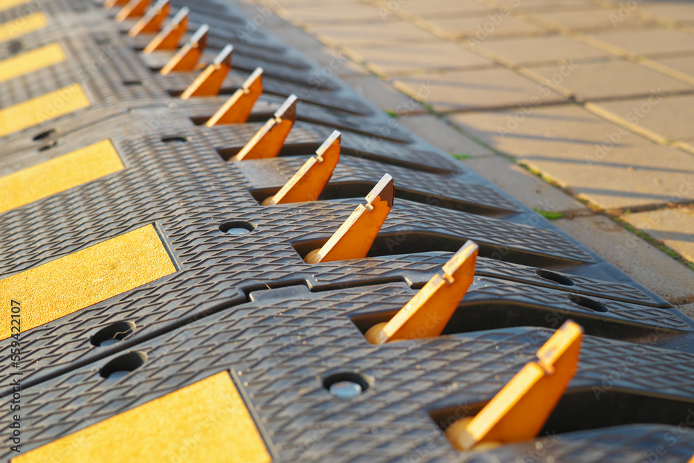 One way traffic speed bump with spikes is on the road. Stock Photo ...