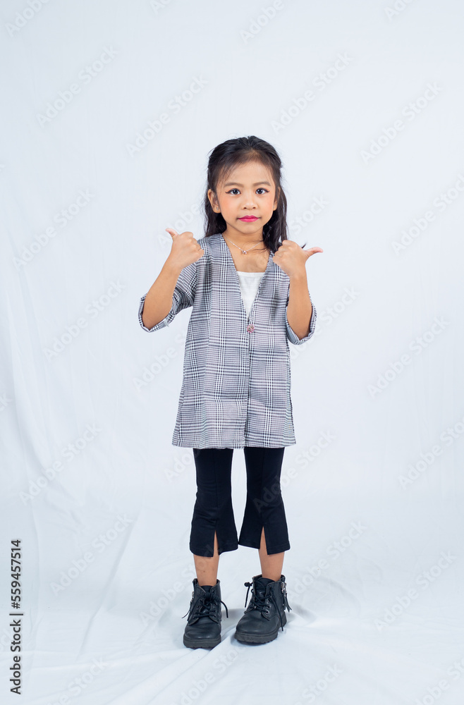 Kid model girl posing in studio background. 5 years old asian kid hand ...