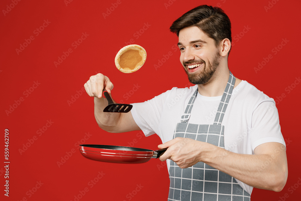 Side view young happy male housewife housekeeper chef cook baker man ...